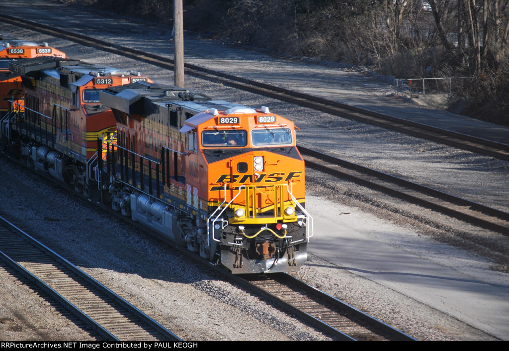 BNSF 8029 in a close up shot as she heads west and gets close to the 26th/Goddard St. Bridge at ...
